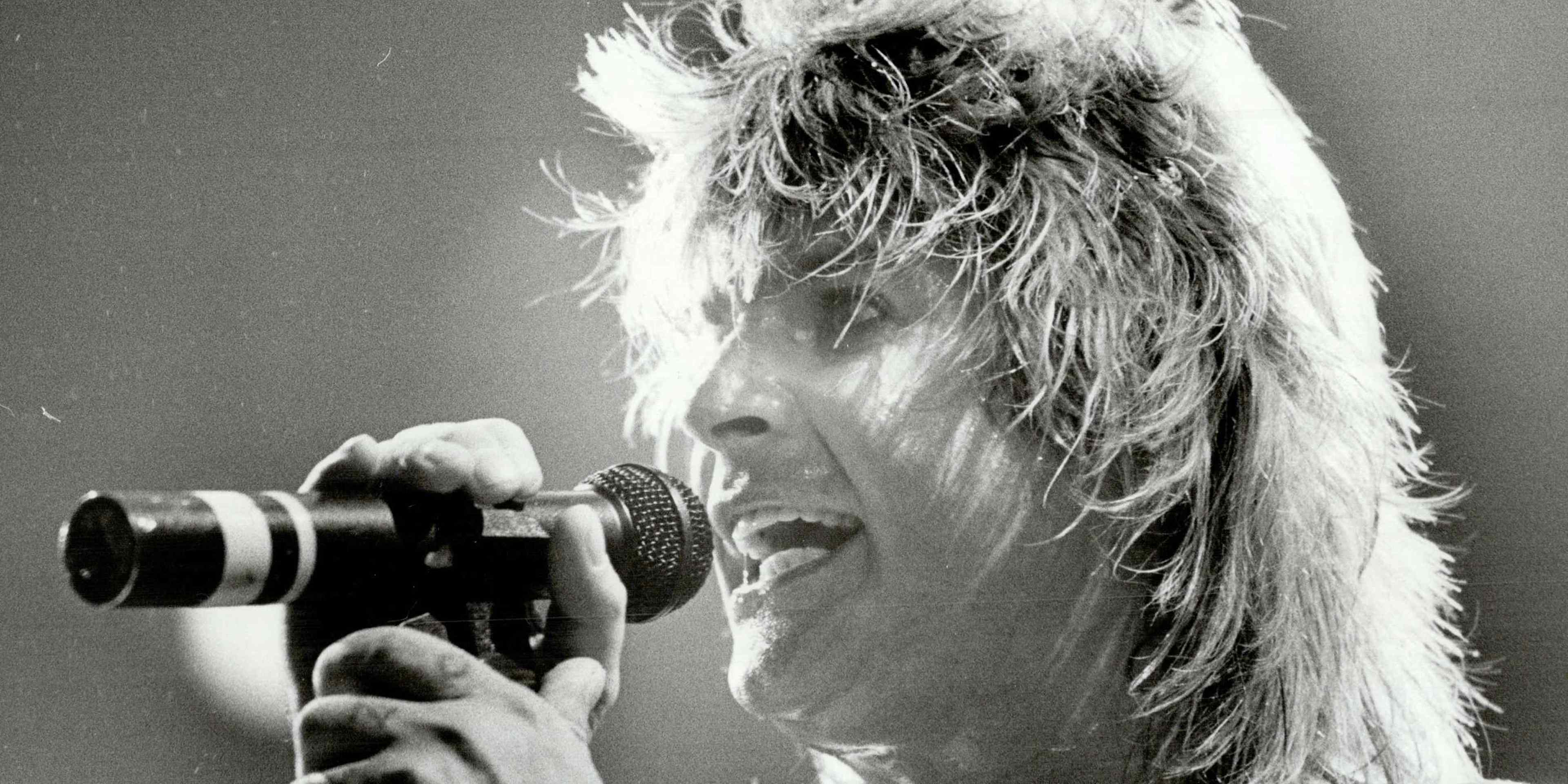 Singer Ozzy Osbourne bites the head off a bat on stage