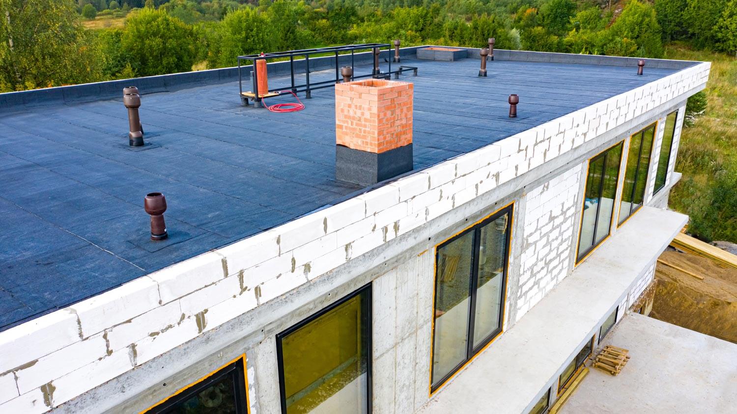 Who Should I Hire to Perform Flat Roof Repair? | Angi