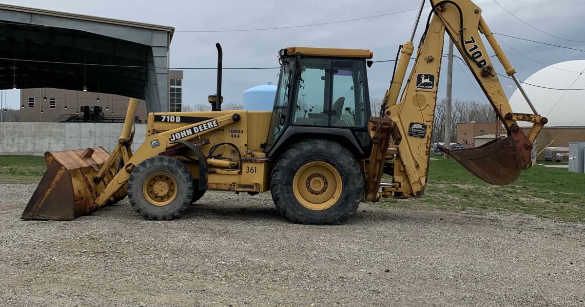 1999 John Deere 710D Backhoe/Loader 4x4 - BidCorp Auctions