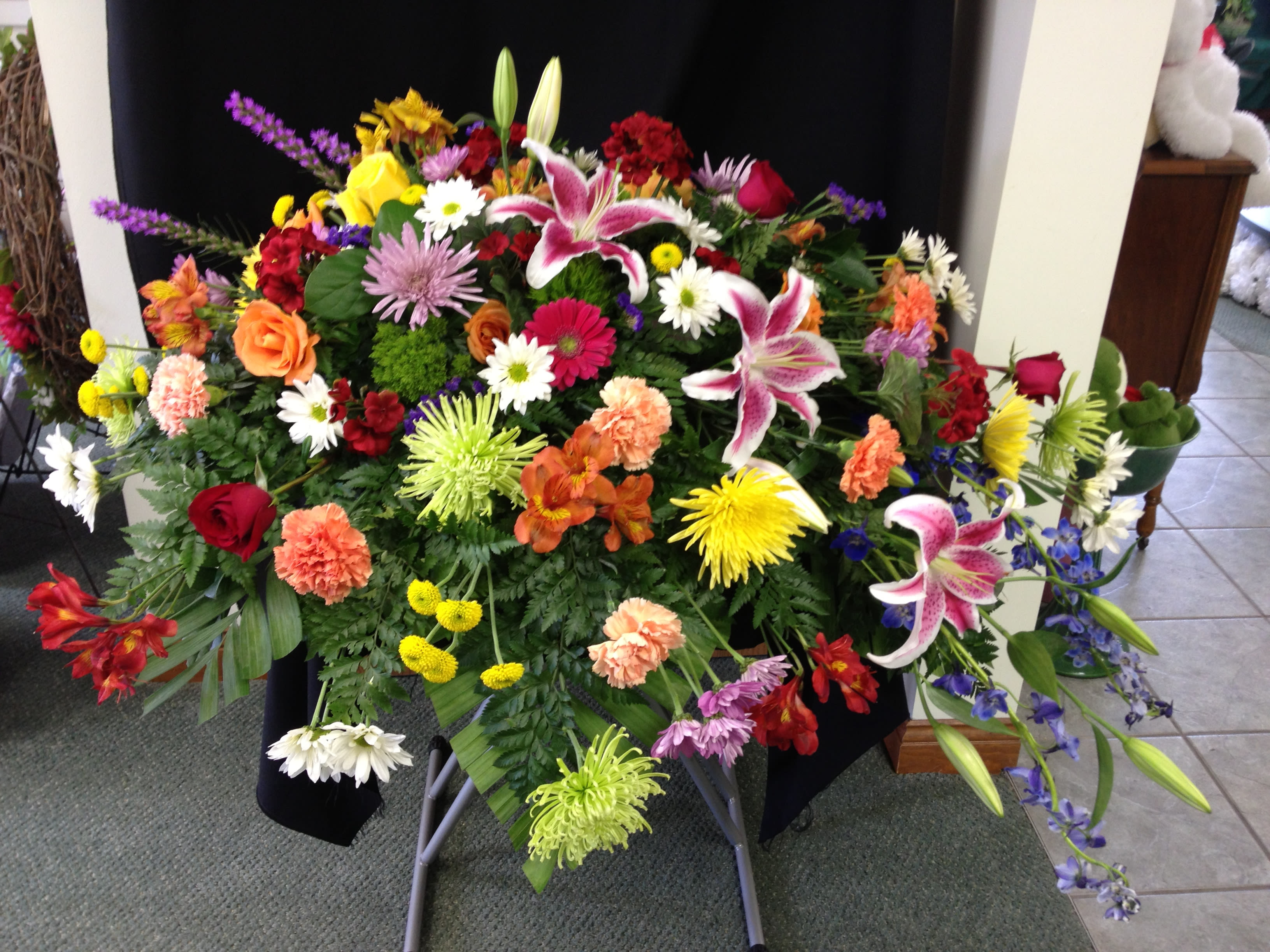 Mixed Spring Casket Spray in Charleston, IL | Noble Flower Shop Mixed Spring Casket Spray in Charleston, IL | Noble Flower Shop