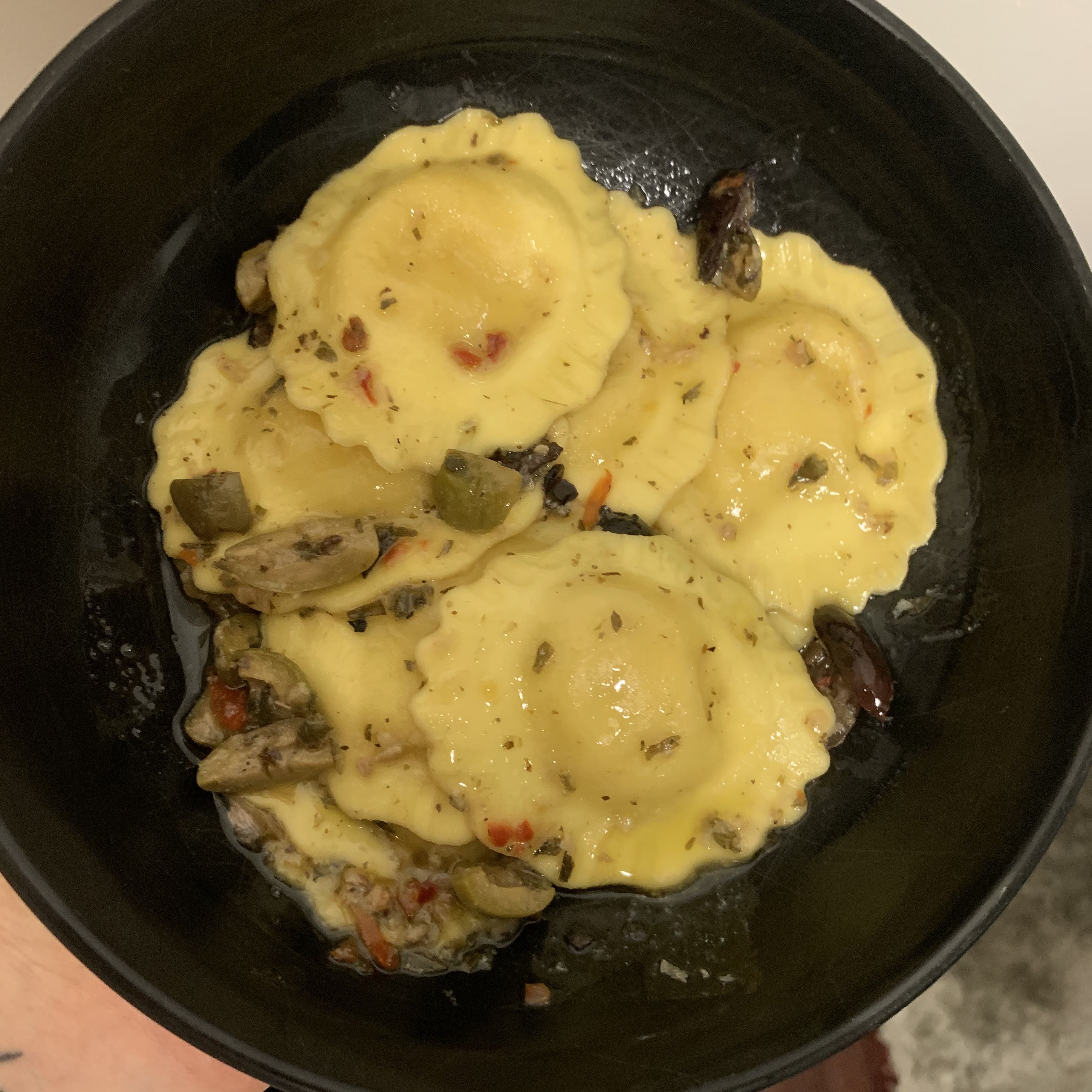 Goats cheese ravioli with Mediterranean olives. | bunch