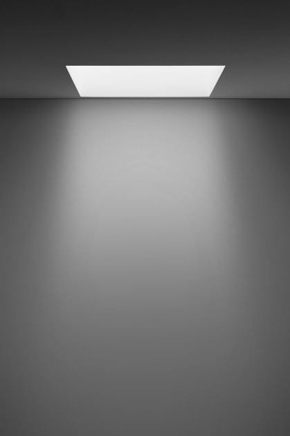 Shaded wall illuminated by square ceiling light mockup