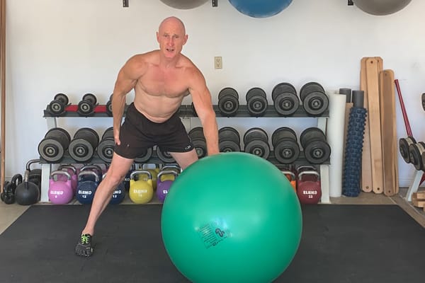 A Single-Arm Push-up With a Swiss Ball – CHEK INSTITUTE