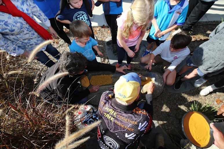 Preschoolers reunite with handshakes and hand prints