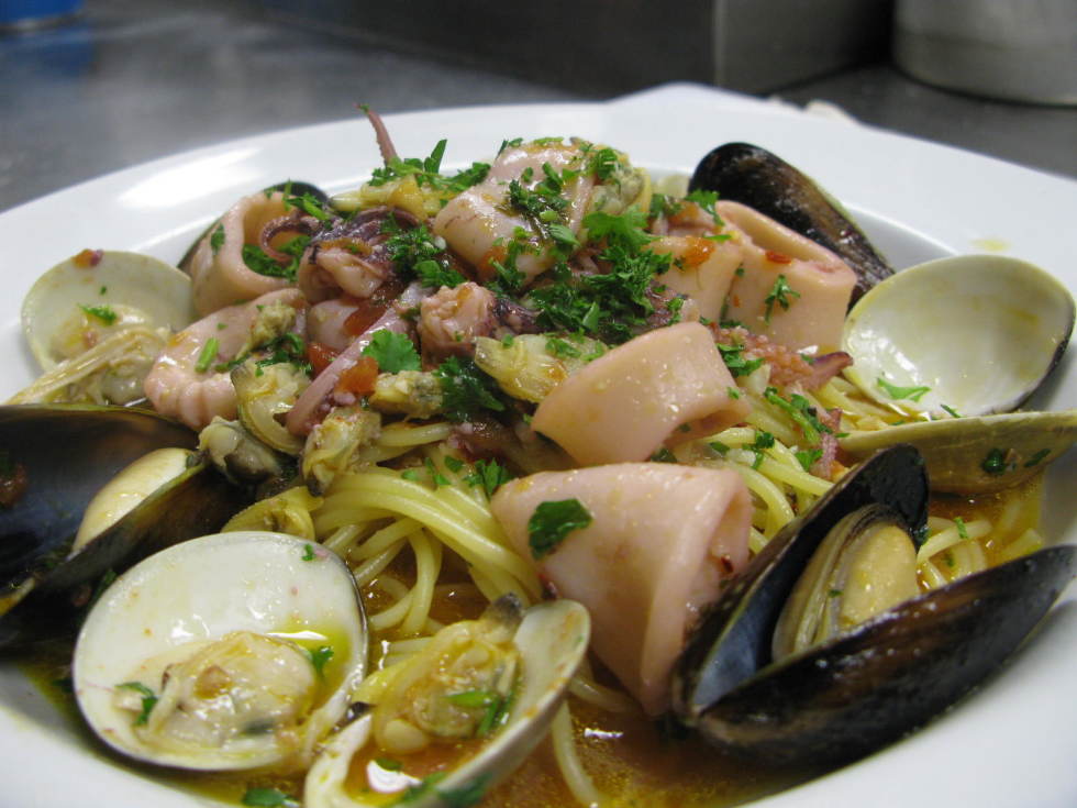 Watch the cheese show while you dine at La Perla Italian restaurant ...