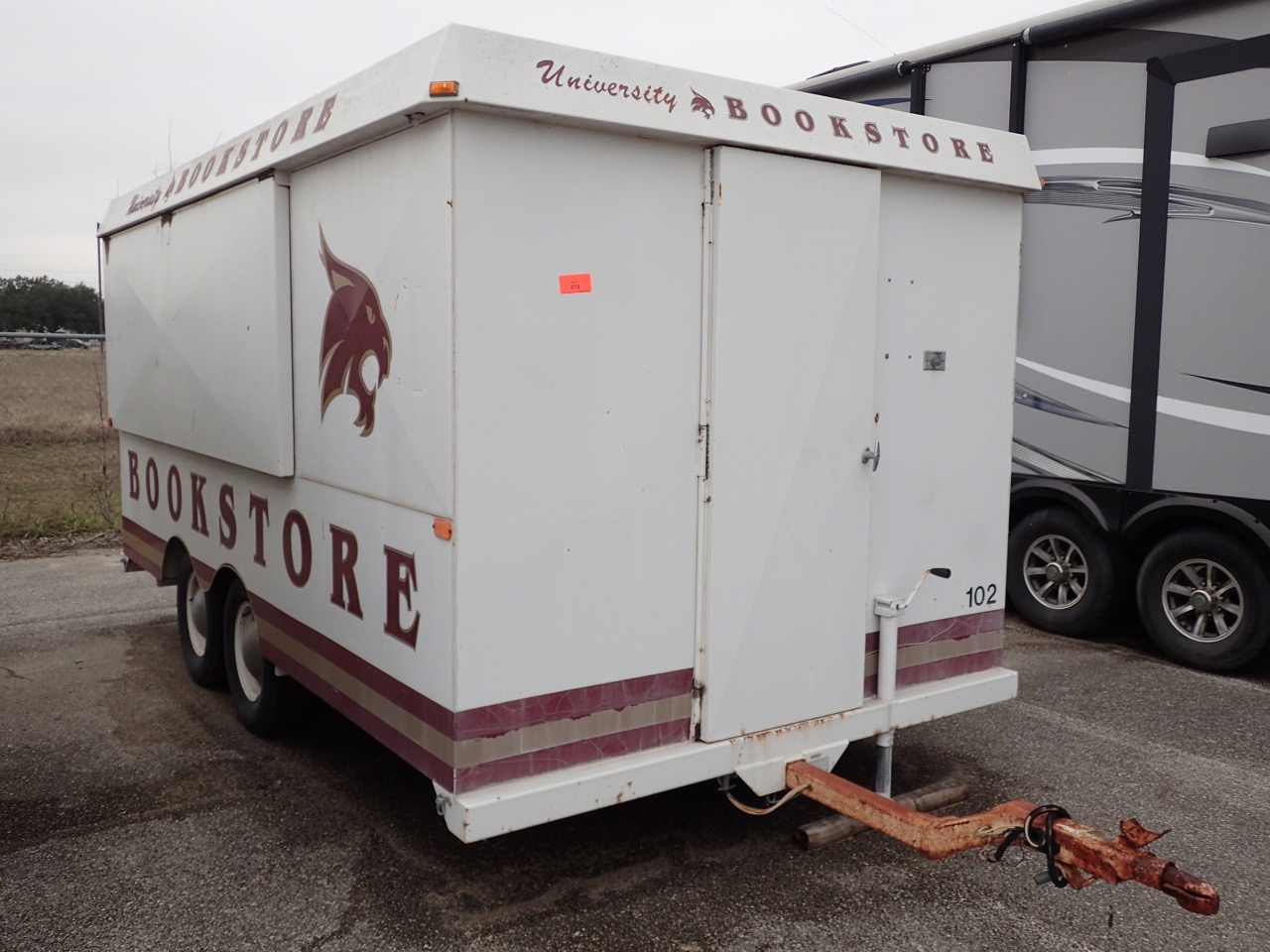 (1) 14' Supreme Products Tandem Axle Bookstore Trailer | Surplus Marketplace