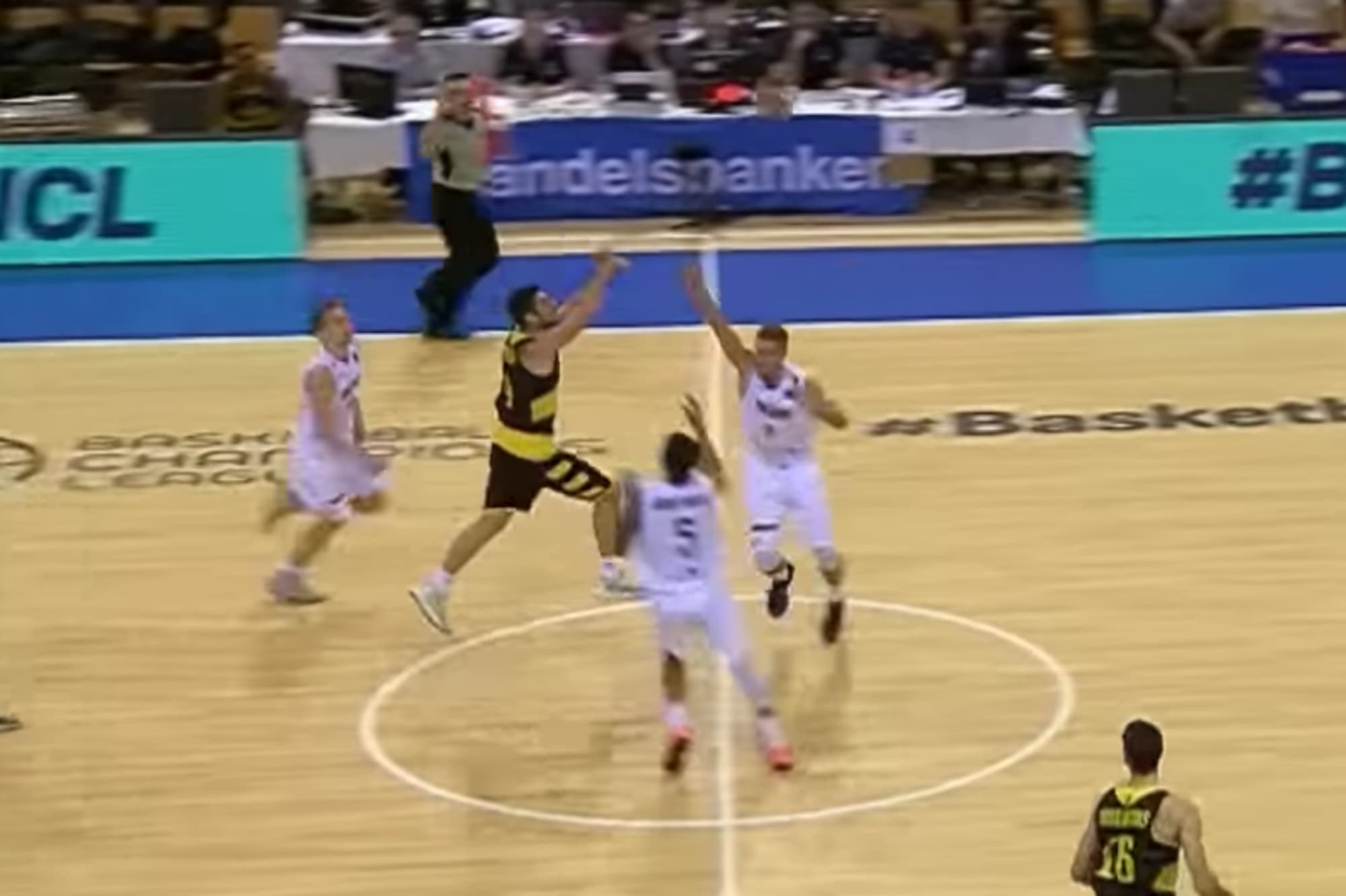 Vassilis Xanthopoulos dials in from beyond half court at the buzzer ...