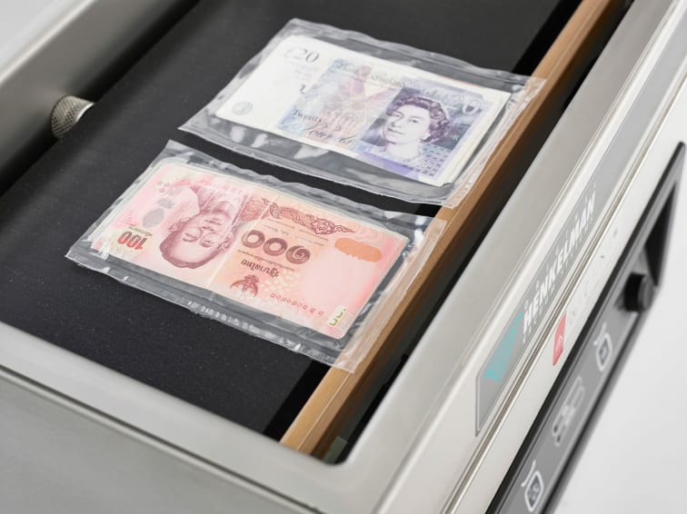 Vacuum sealing money and documents | Henkelman