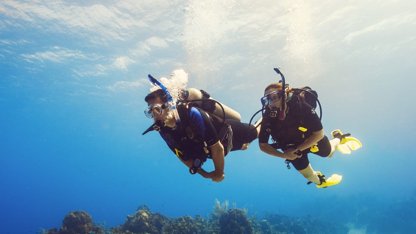 Two divers under the water