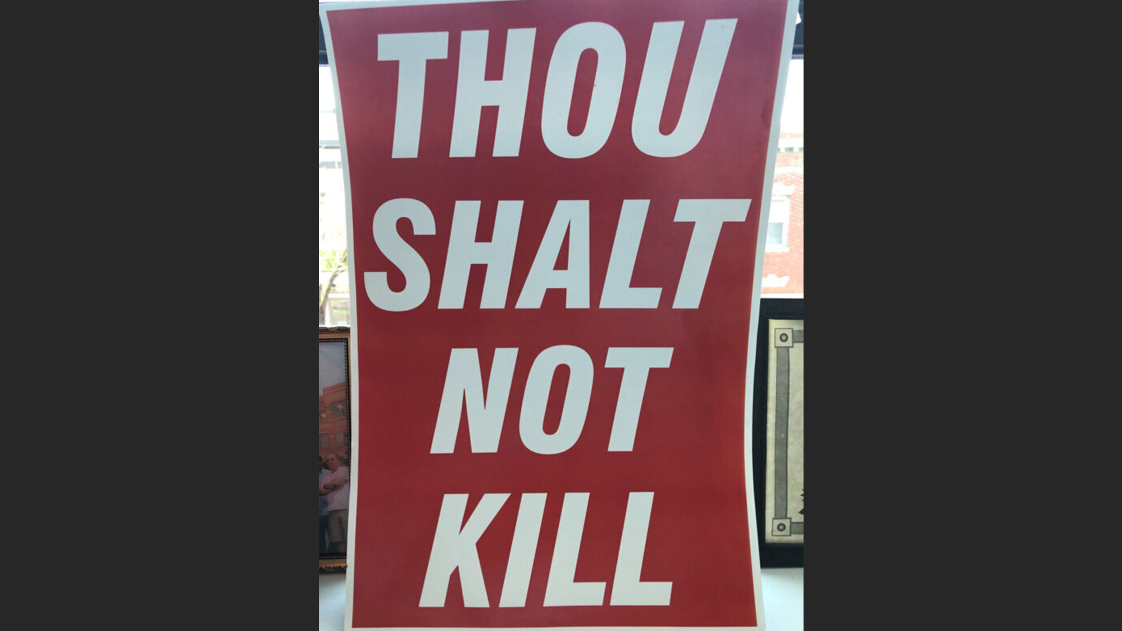 This U.S. city is fighting gun violence with posters that say 'Thou ...