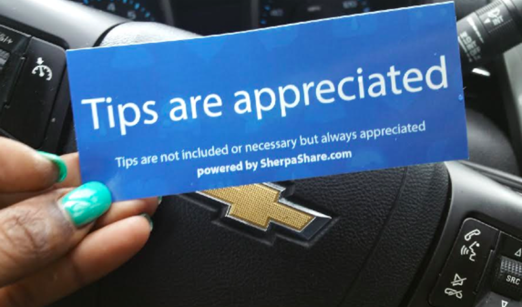 Uber drivers can now ask for tips, so this company made them signs ...