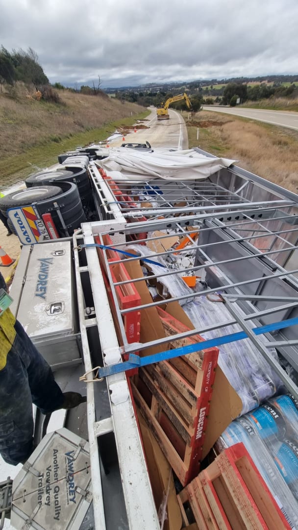 Paint mishap on major highway as truck rolls - Yass - Fire and Rescue NSW
