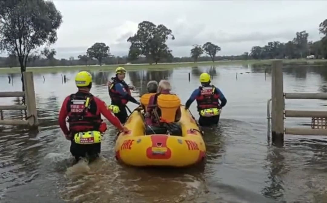 'In-water' firefighters rescue elderly couple and their dog from fast ...