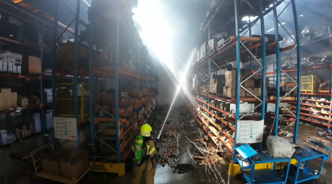 Firefighters stop blaze spreading to Lithium-Ion battery storage site ...