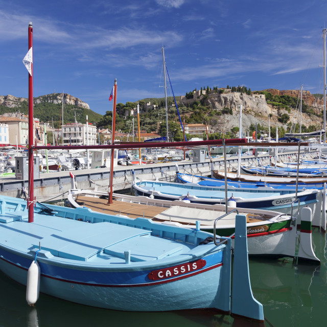 Fishing boats at the harbour, castle in the background, Cassis ...
