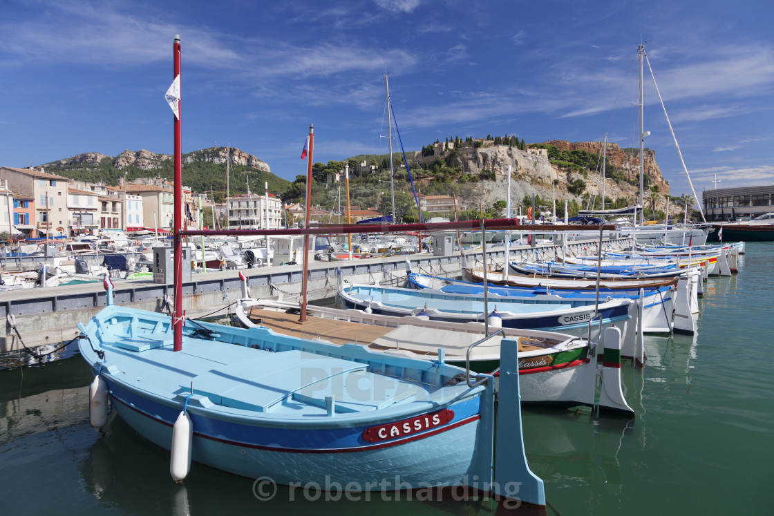 Fishing boats at the harbour, castle in the background, Cassis ...