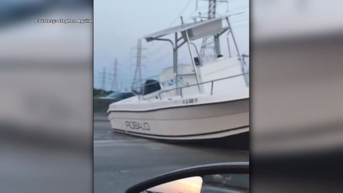 VIDEO: Boat falls off trailer and onto Gulf Freeway