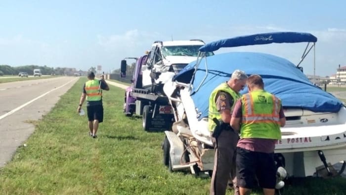 Boat falls off trailer, hits SUV in Brevard