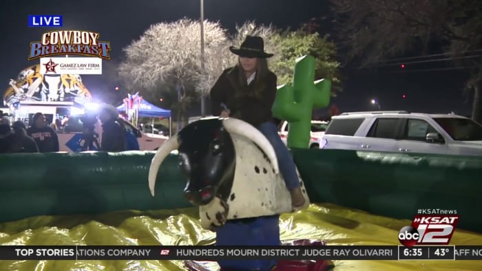 WATCH: KSAT's Sarah Acosta rides mechanical bull at Cowboy Breakfast