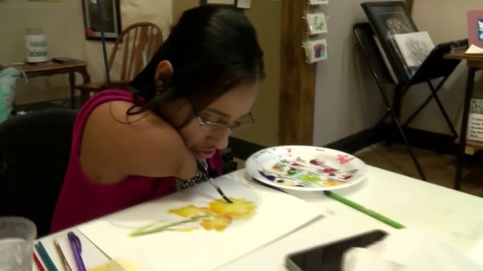 Artist with no hands, legs creates beautiful paintings