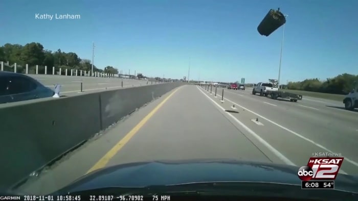 WATCH: Flying trash can flies into windshield on busy Texas highway