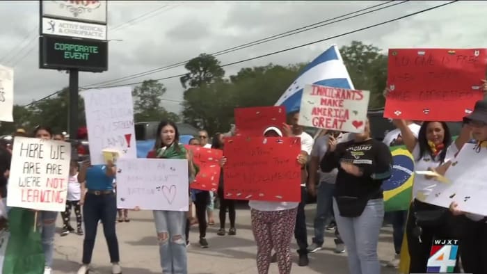 100+ people line Jacksonville street to protest new Florida immigration ...