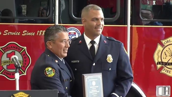 Orlando firefighter honored after pulling Seminole deputy from fiery crash
