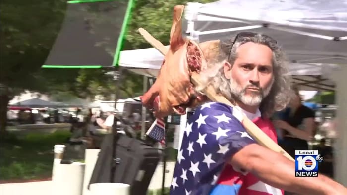 Law enforcement watches over courthouse protesters, including man with ...