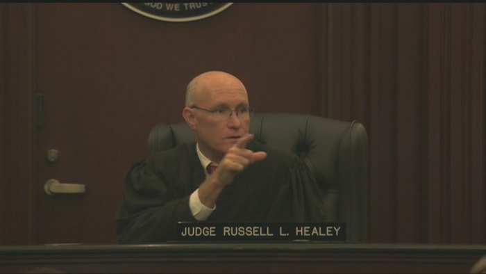 Who is Judge Russell Healey?