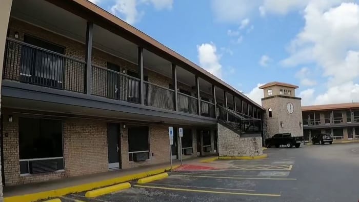 Downtown hotel turned homeless shelter gets first residents