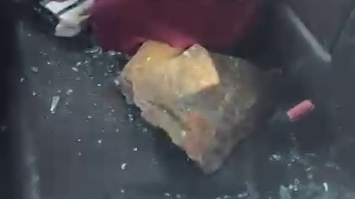 No more charges filed against men accused of throwing rock through ...