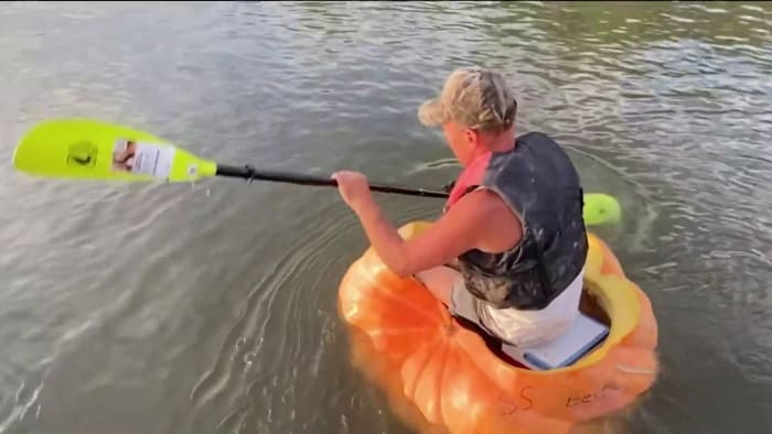 Oh, my gourd! Man paddles down river in pumpkin