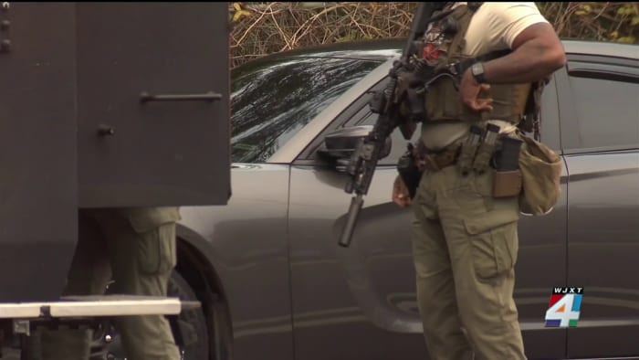 Burglary suspect armed with gun, knife shot by SWAT officer after ...