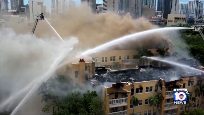 Worker found shot after Miami apartment building goes up in flames ...
