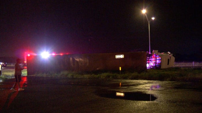 Van fails to yield onto highway, causes 18-wheeler to rollover, police say