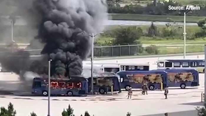 Crews extinguish flames after 2 Universal Orlando buses catch fire
