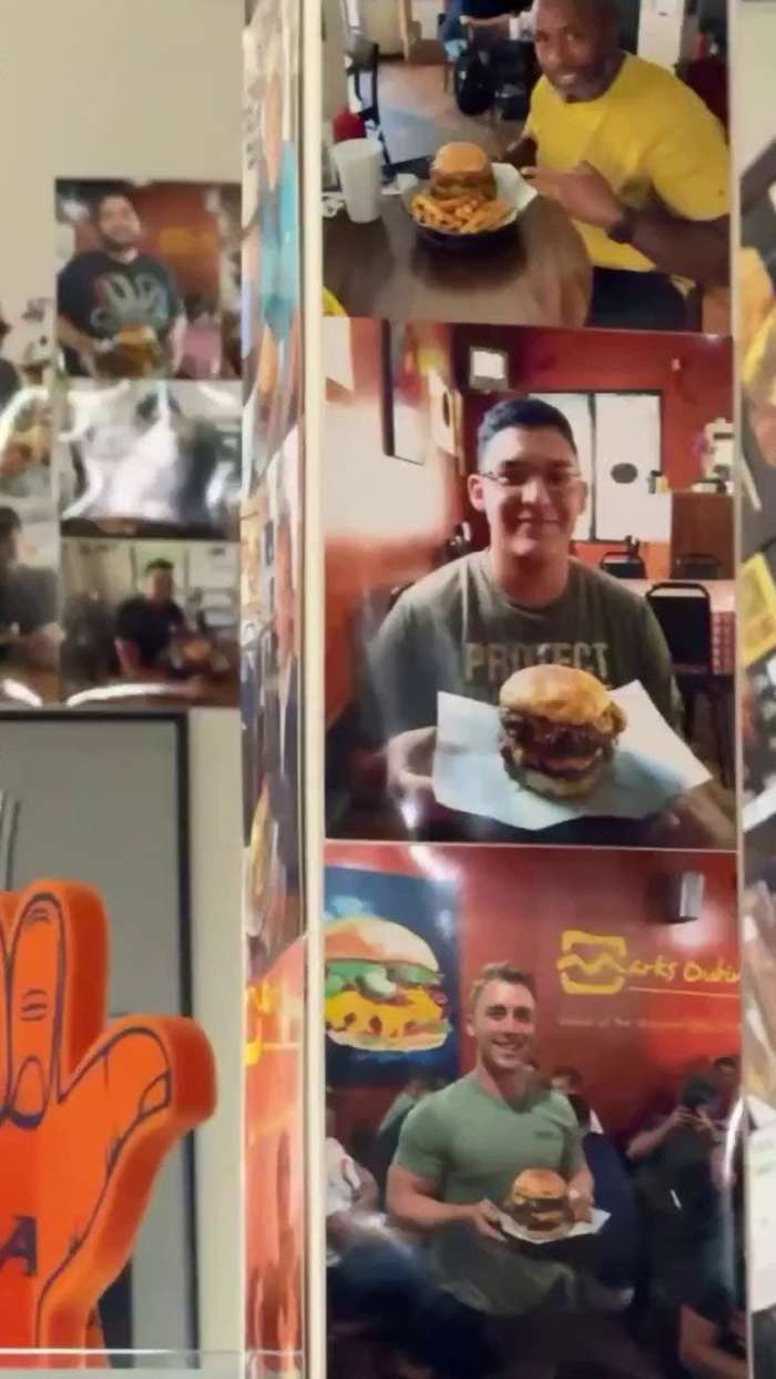 Look how many photos there are hanging in this burger joint