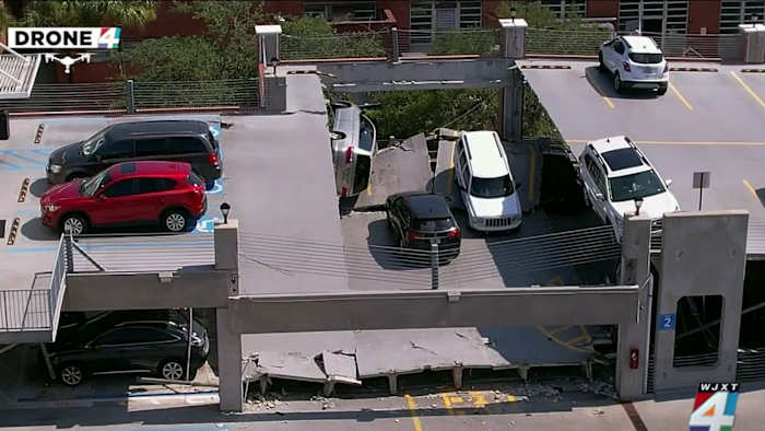 Remote-controlled towing machine removes cars from collapsed garage