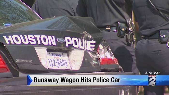 Runaway wagon hits police car