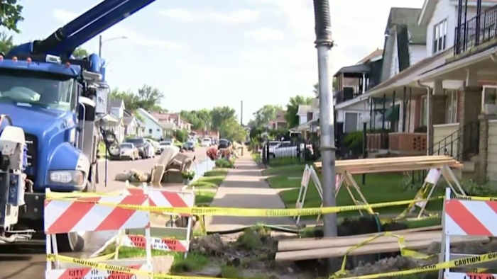 Punctured pipe causes river of water on American Street in Detroit ...