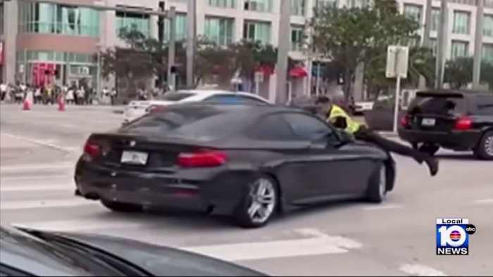 Cellphone video shows Miami police officer on hood of car before ...