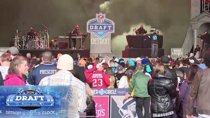 Football fans party in the streets during NFL draft in downtown Detroit