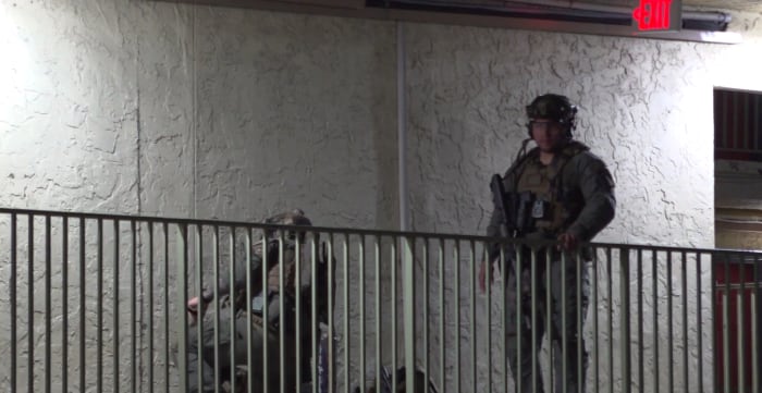 Man arrested after assaulting woman, getting into standoff with SWAT at ...