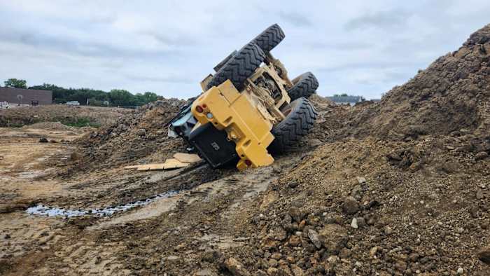 Emergency crews rescue worker after front-end loader rolls at Ann Arbor ...