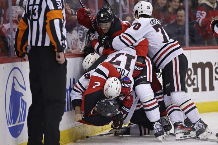 Blackhawks rookie Connor Bedard departs after big hit by Devils ...