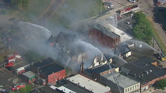 Crews battle fire affecting several buildings in Downtown Holly