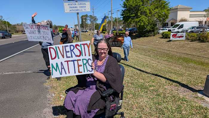Demonstrators gather outside congressman’s office in Clay County to ...