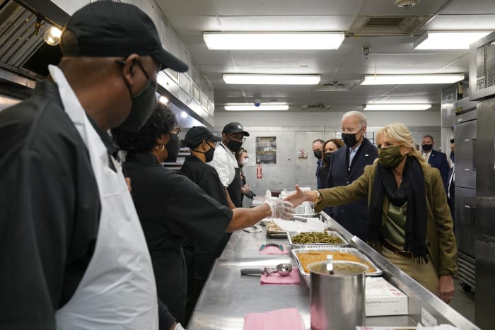President, VP and spouses assist food kitchen for holiday