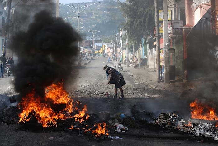 Haiti's government adopts a 'war budget' as town after town falls to gangs