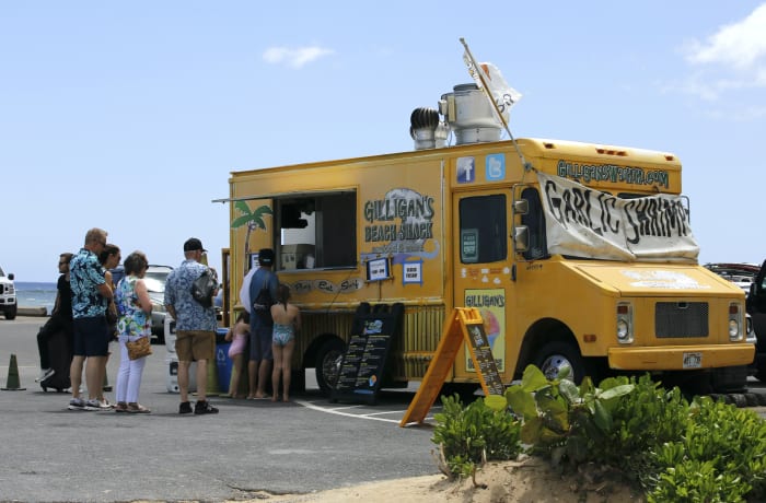 Pandemic-weary Americans plan for summer despite COVID surge
